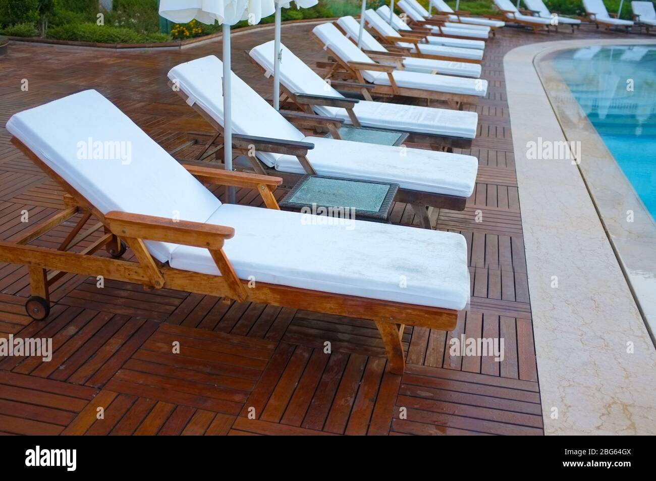 Lounge sunbed in swimming pool Stock Photo - Alamy