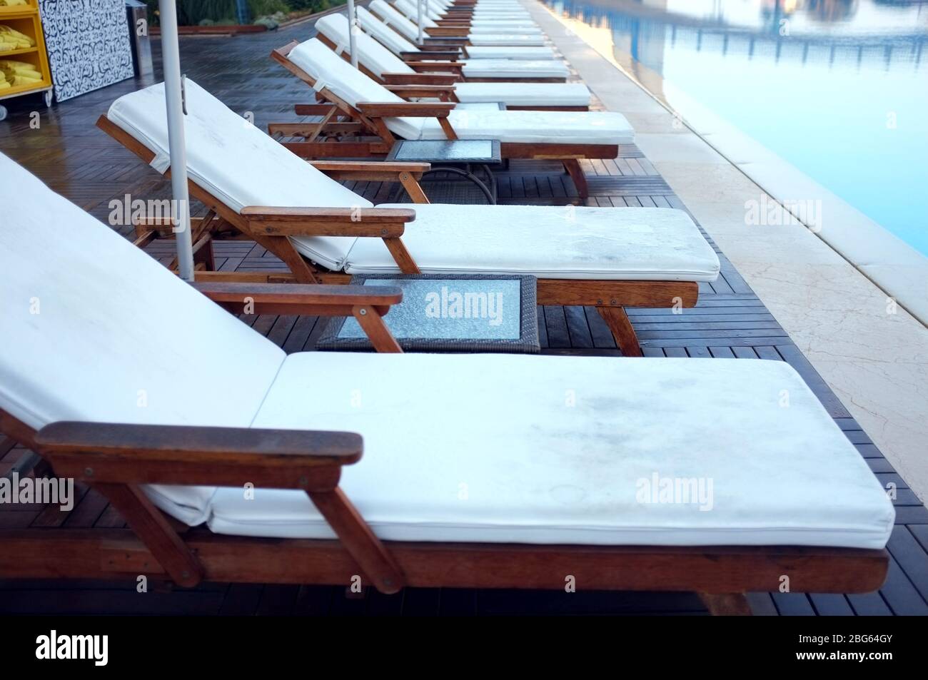 Lounge sunbed in swimming pool Stock Photo - Alamy