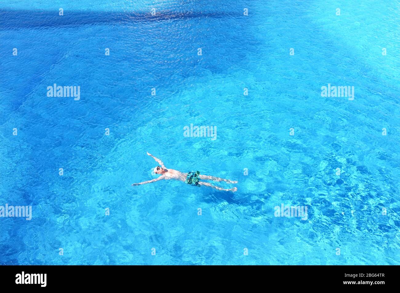 Relaxing in swimming pool Stock Photo - Alamy