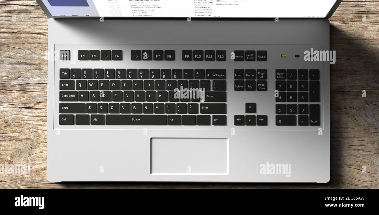 Laptop open, top view on wood. Computer keyboard view from above, desk ...