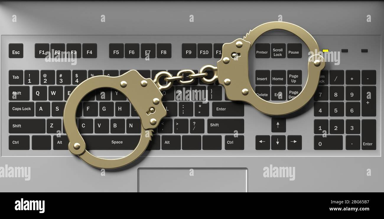 Cyber crime. Handcuffs on a computer laptop background, top view. Bribe ...