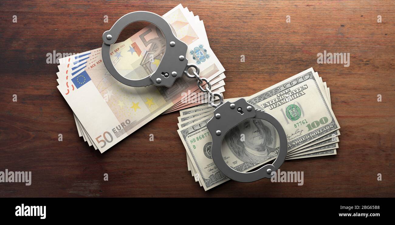 Money and crime. Handcuffs on US dollars and euro banknotes, wood table ...