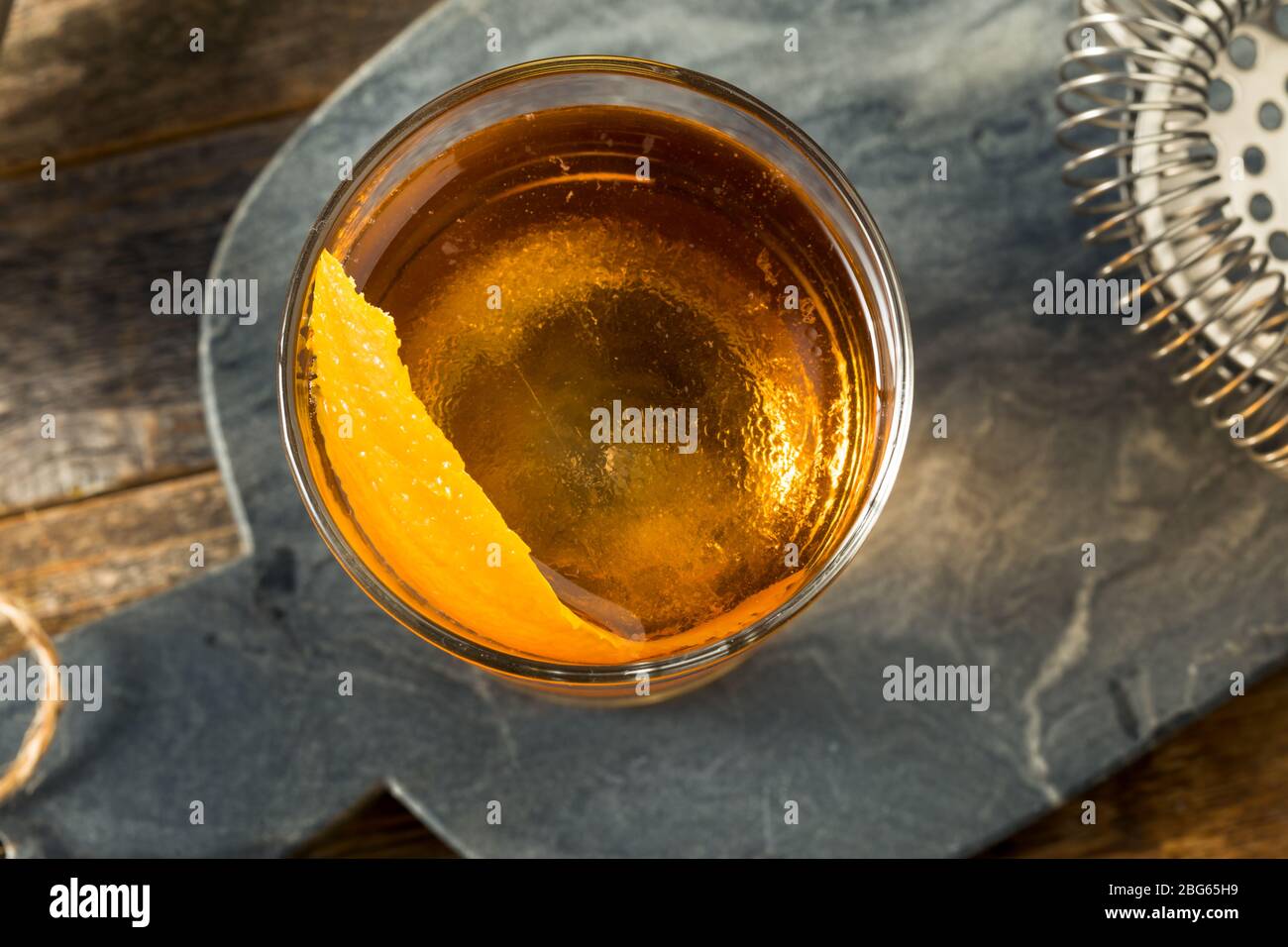 Refreshing Bourbon Old Fashioned Cocktail with Round Ice Cube Stock ...