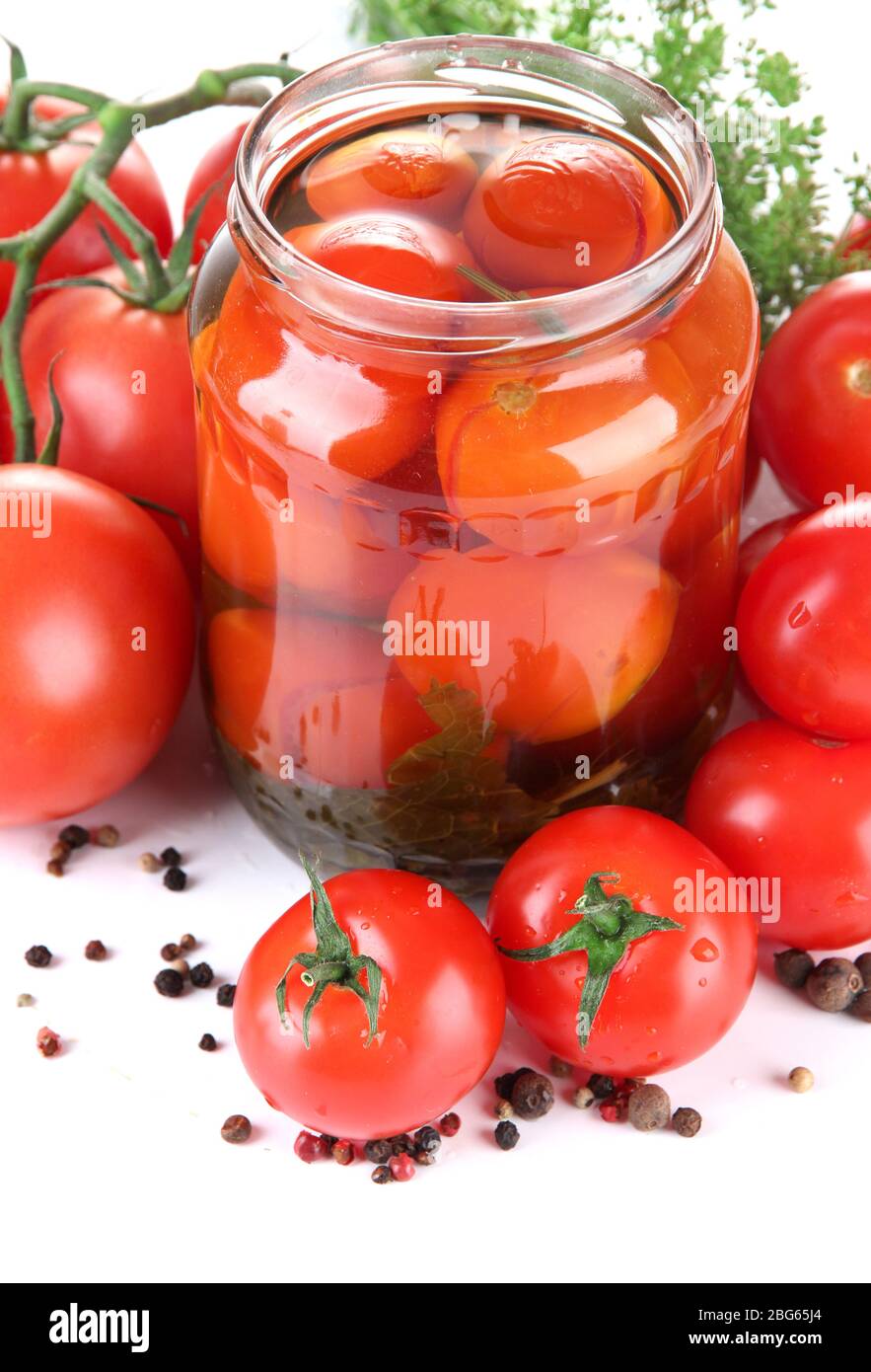 Open glass jar of tasty canned tomatoes, isolated on white Stock Photo ...