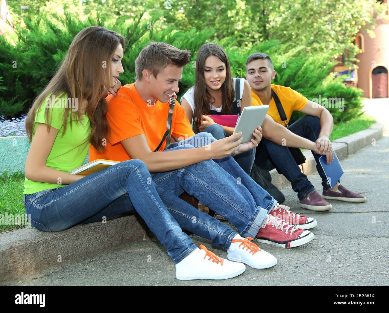 Happy students notebooks laptop hi-res stock photography and images - Alamy