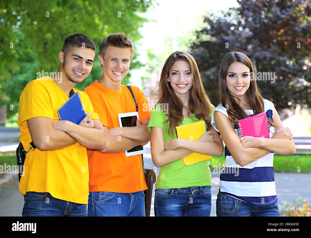 Four students outside school standing hi-res stock photography and ...