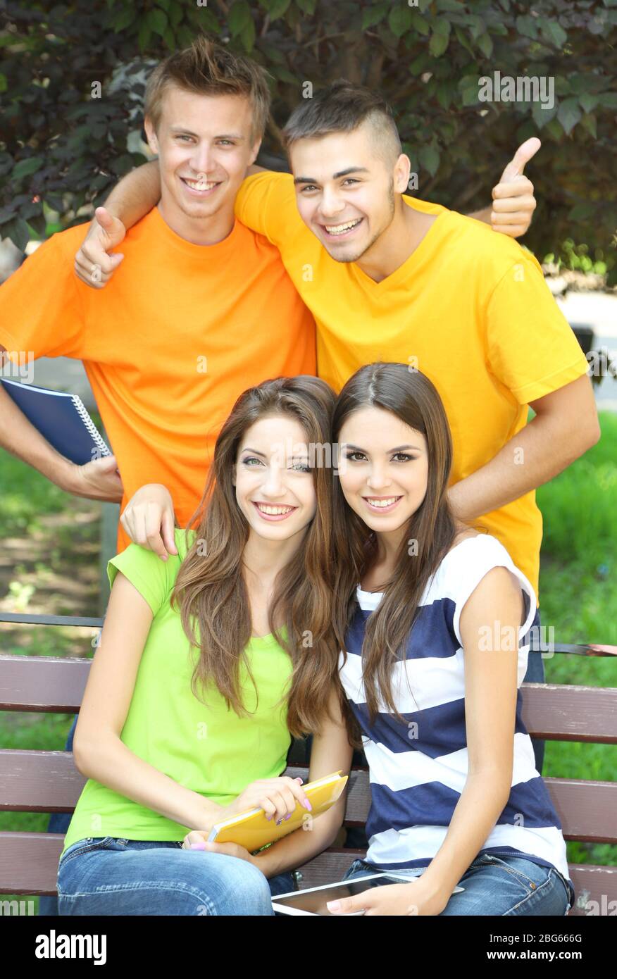 Four students studying outdoors hi-res stock photography and images - Alamy