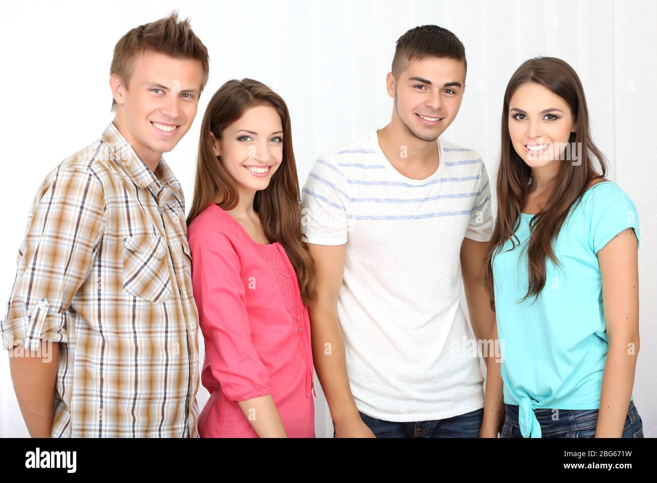 Group of happy beautiful young people at room Stock Photo - Alamy