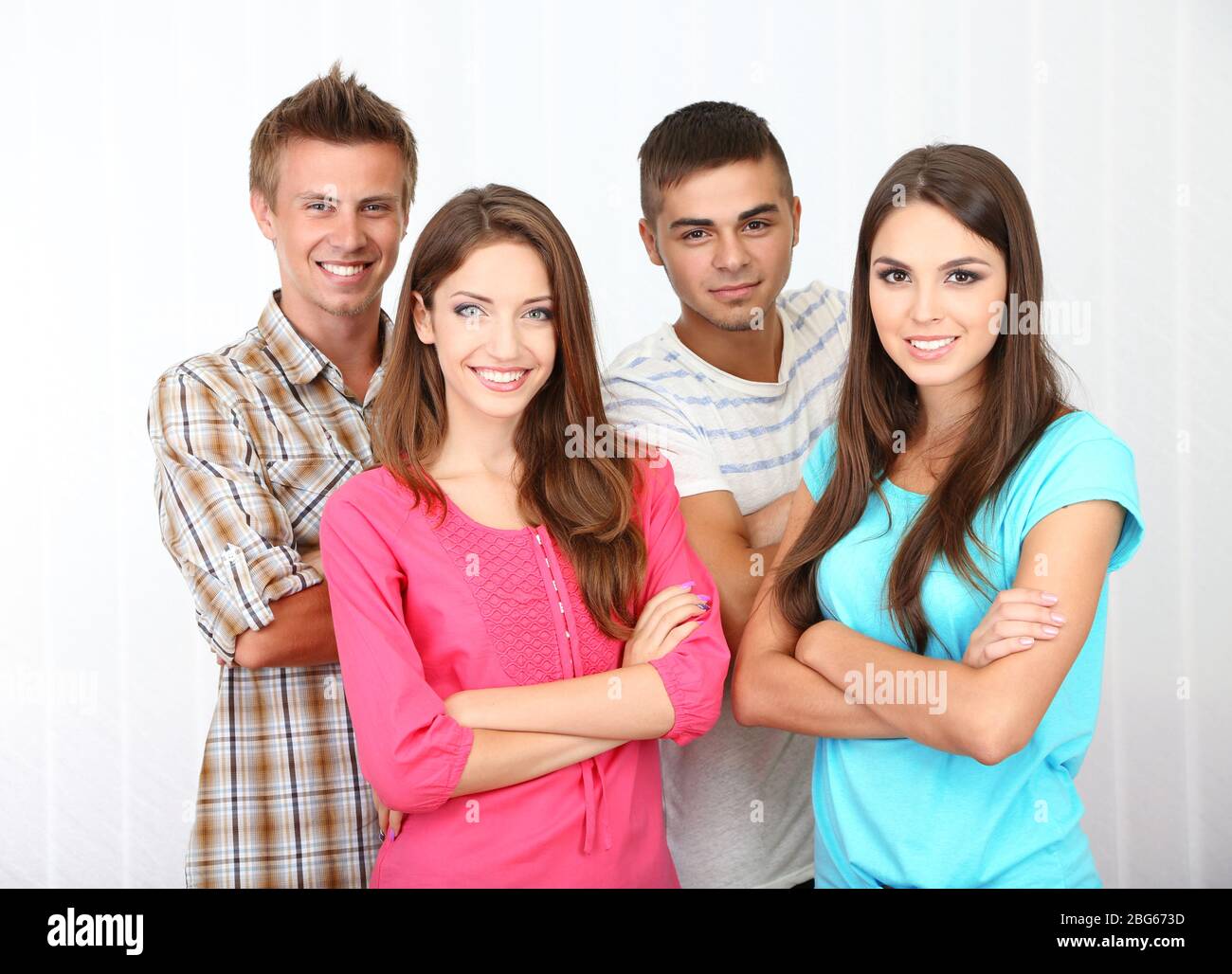 Group of happy beautiful young people at room Stock Photo - Alamy