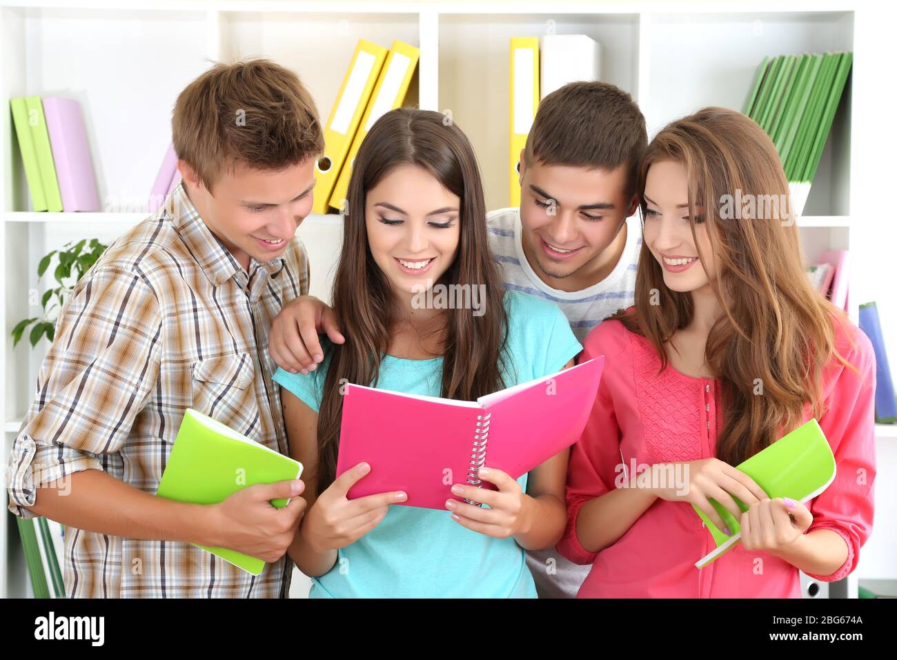 Group of happy beautiful young students at room Stock Photo - Alamy