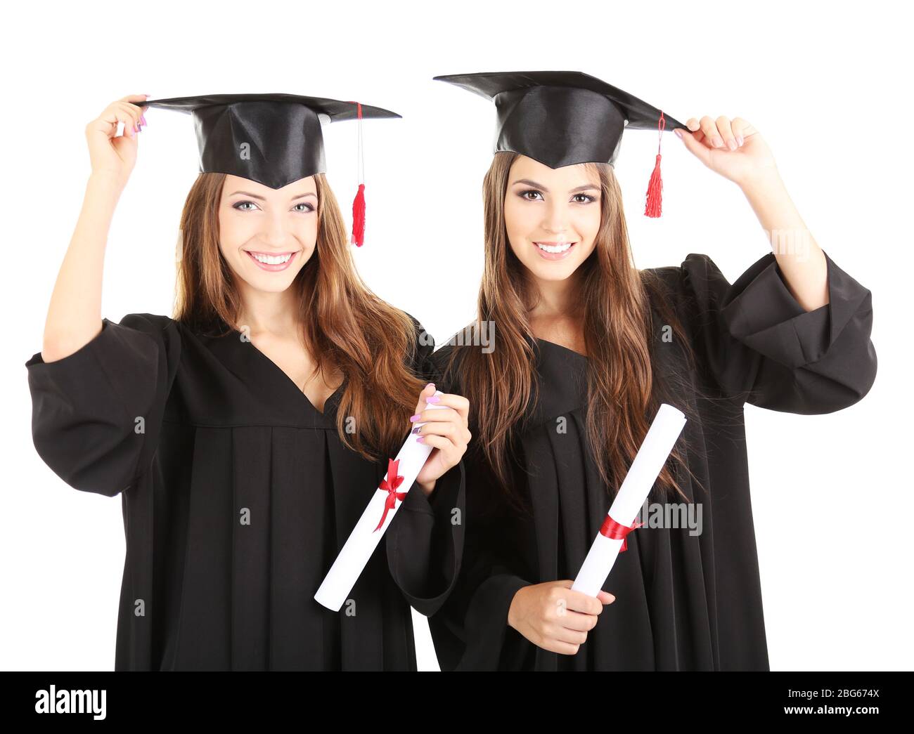 Two happy graduating students isolated on white Stock Photo - Alamy