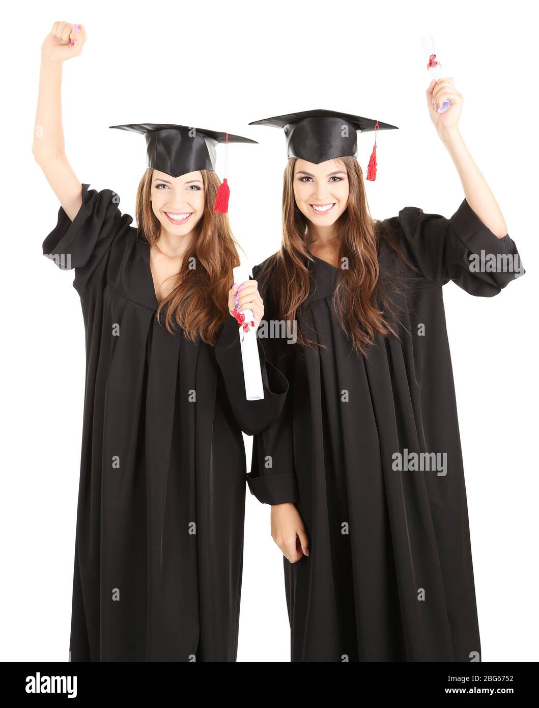 Two happy graduating students isolated on white Stock Photo - Alamy