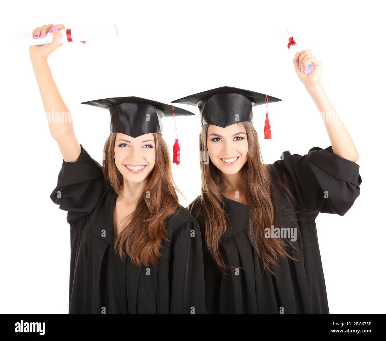 Two happy graduating students isolated on white Stock Photo - Alamy