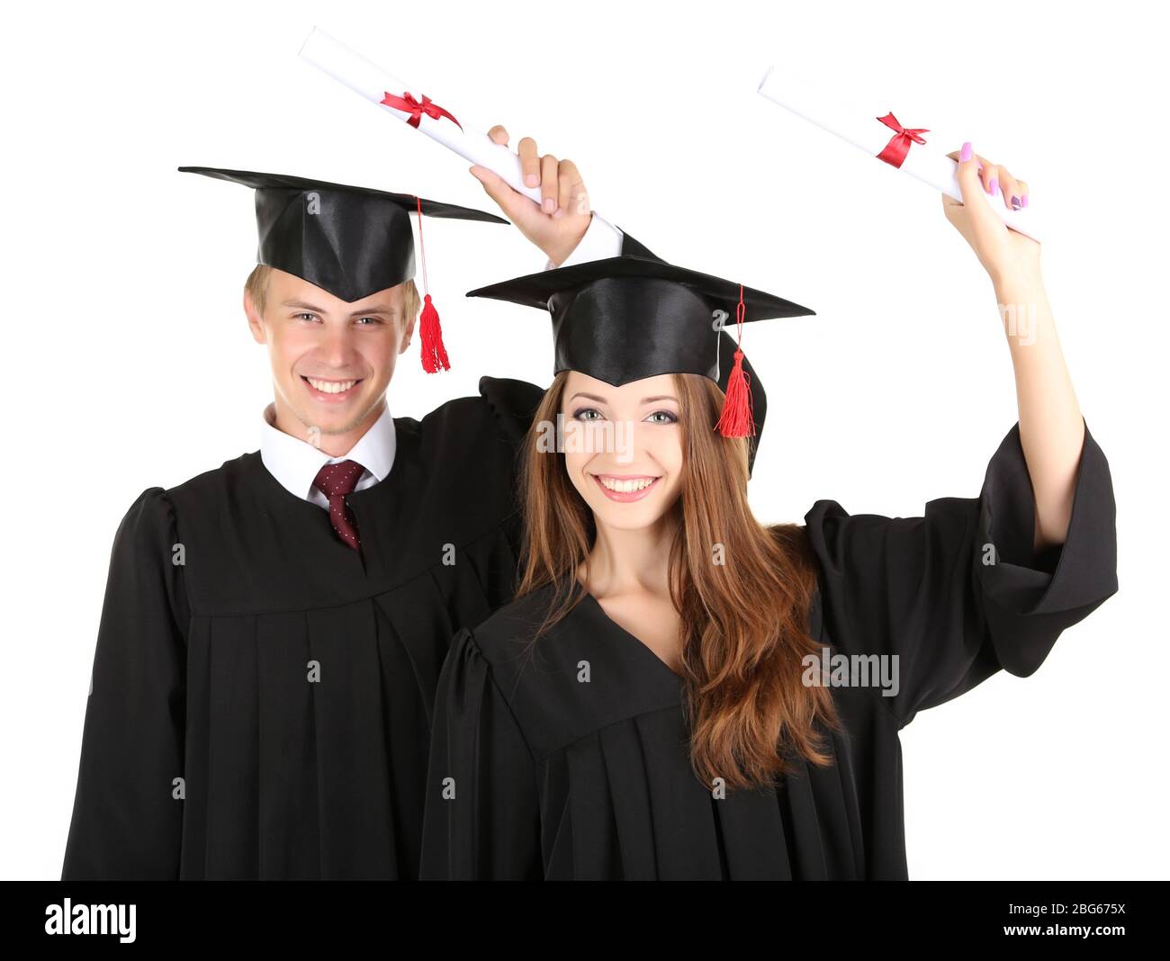 Two happy graduating students isolated on white Stock Photo - Alamy