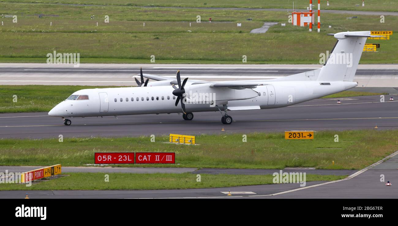 White Passenger Airplane Taxi in an Airport Stock Photo - Alamy