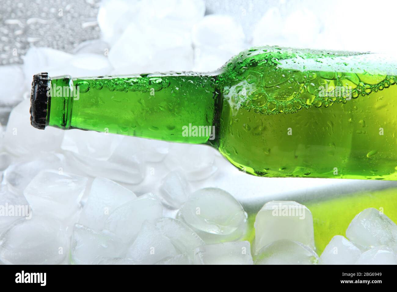 Bottle of beer with ice cubes, close up Stock Photo - Alamy