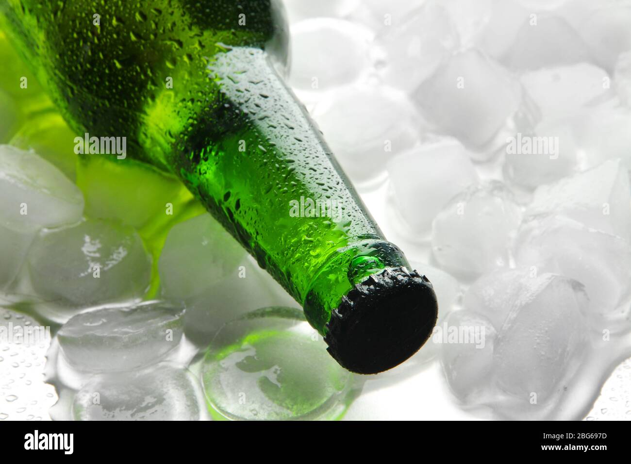 Bottle of beer with ice cubes, close up Stock Photo - Alamy