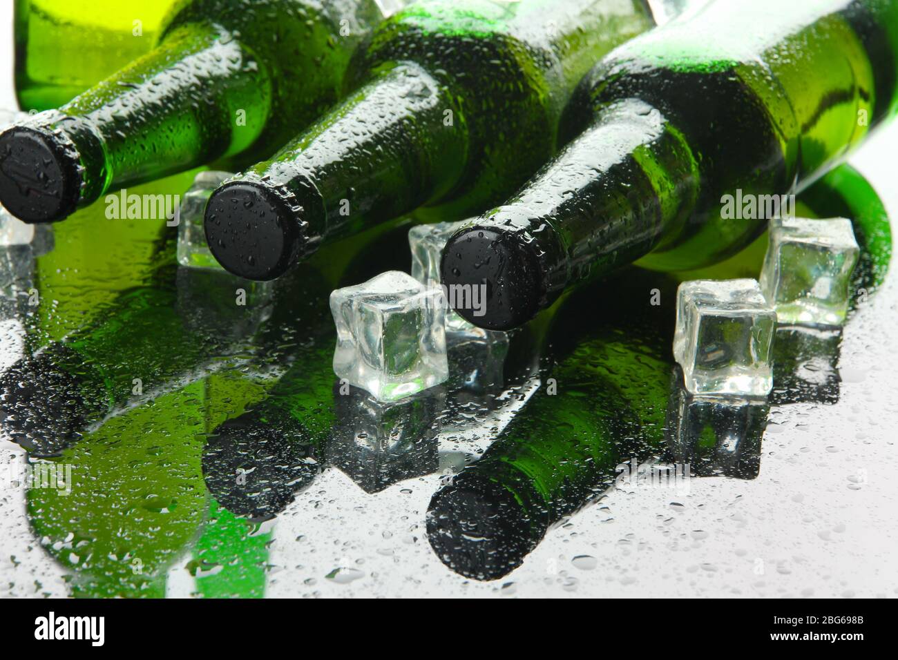 Bottles of beer with ice cubes, close up Stock Photo - Alamy
