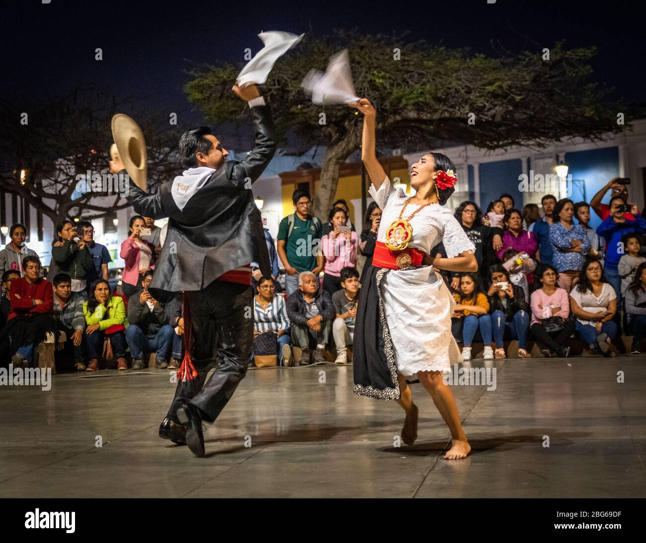 Male and Female dancers in traditional costume performing La Marinera ...