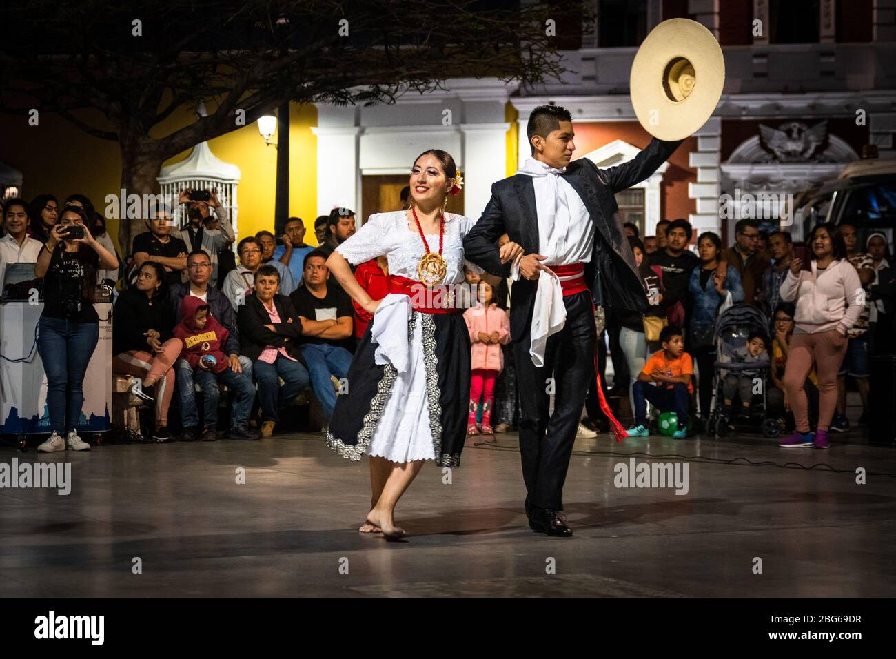 Male and Female dancers in traditional costume performing La Marinera ...