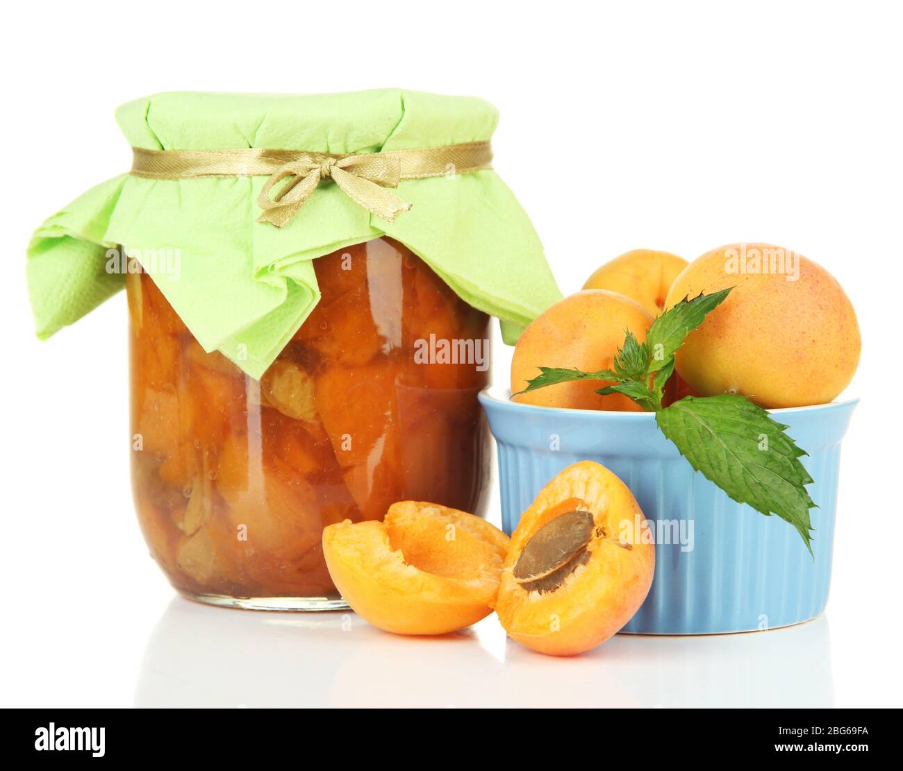 Apricot jam in glass jar and fresh apricots, isolated on white Stock ...