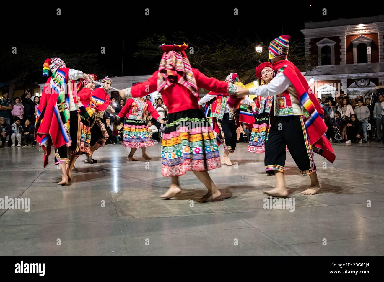 Dancers in colourful costumes performing traditional Huayno Cusqueño ...