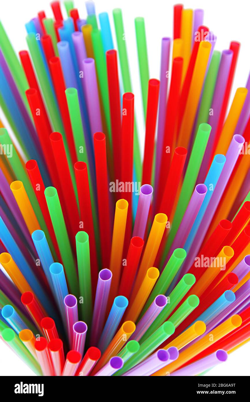 Many straws close-up isolated on white Stock Photo - Alamy