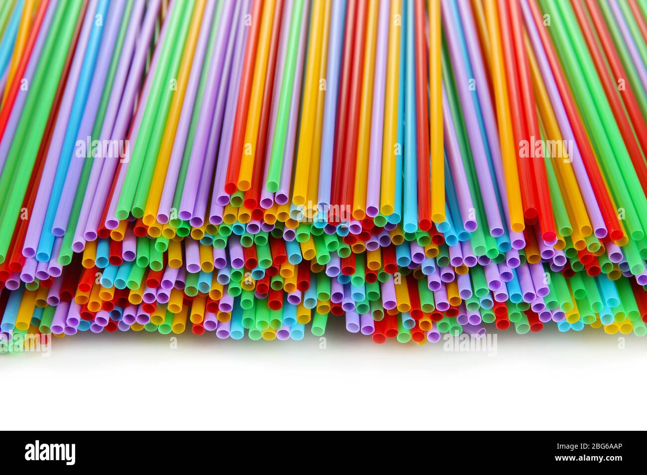 Many straws close-up isolated on white Stock Photo - Alamy