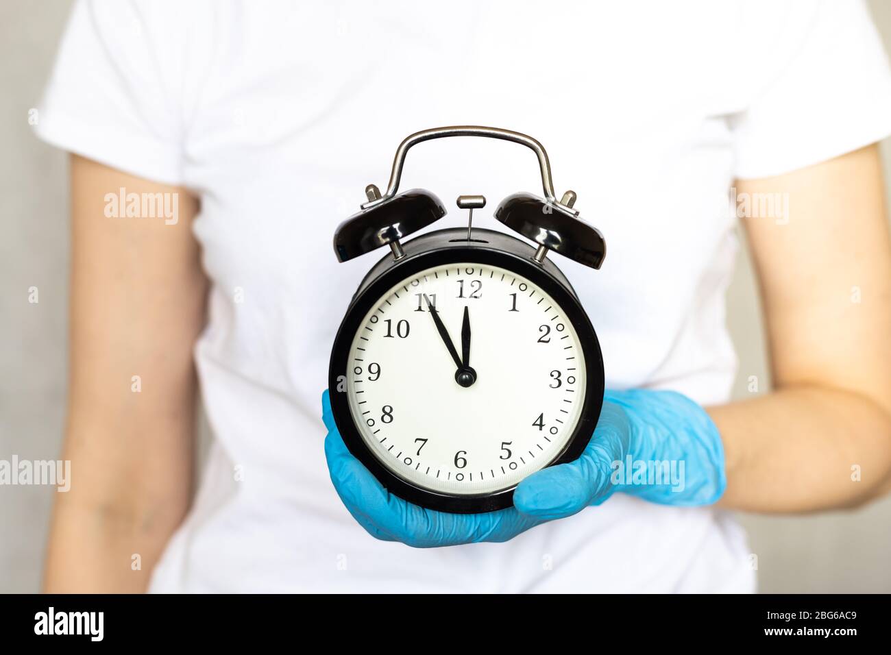 Tired nurse clock hi-res stock photography and images - Alamy