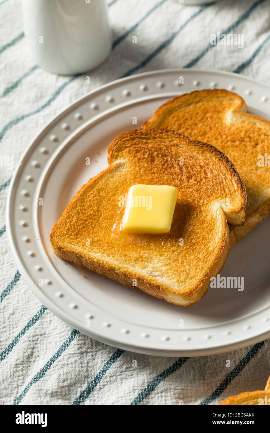 Homemade Warm Buttered Toast for Breakfast on a Plate Stock Photo - Alamy
