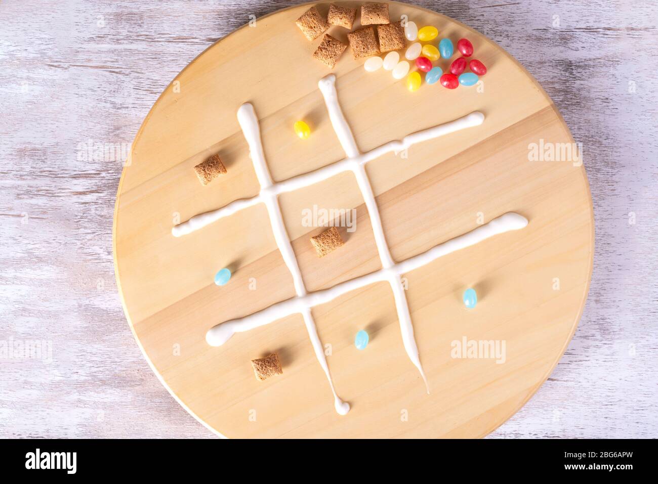 tic-tac-toe game using breakfast cereal and colorful candies Stock ...