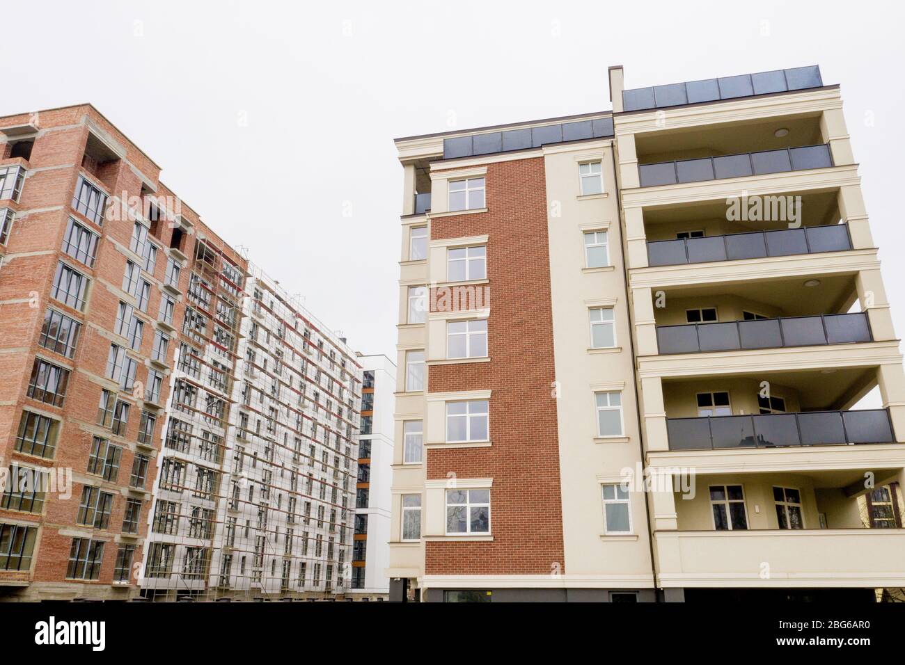 High-rise multi-storey buildings under construction. Tower cranes near ...