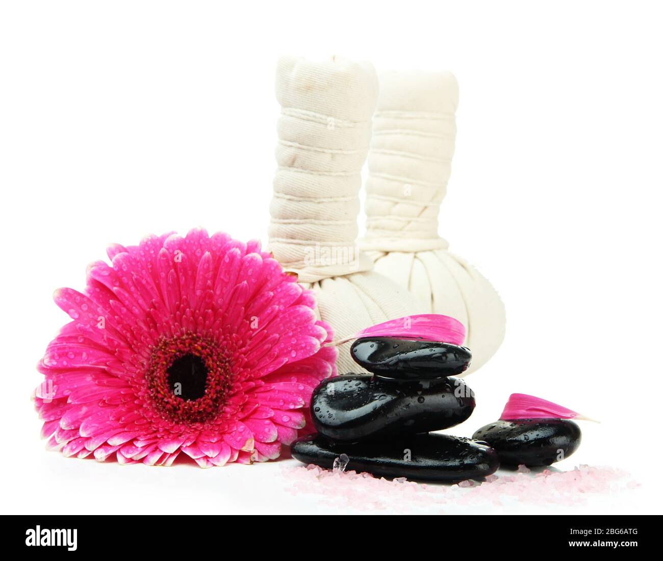 Herbal compress balls for spa treatment and spa stones isolated on ...