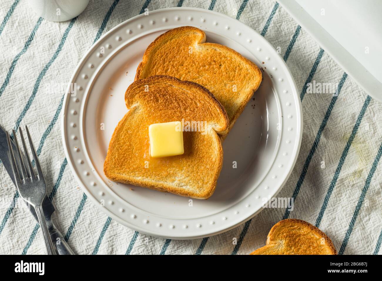 Homemade Warm Buttered Toast for Breakfast on a Plate Stock Photo - Alamy