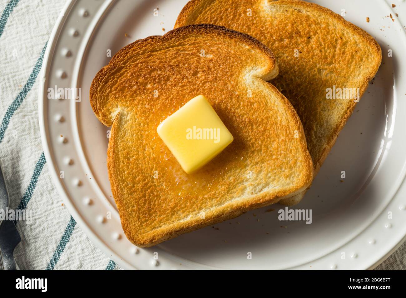 Homemade Warm Buttered Toast for Breakfast on a Plate Stock Photo - Alamy
