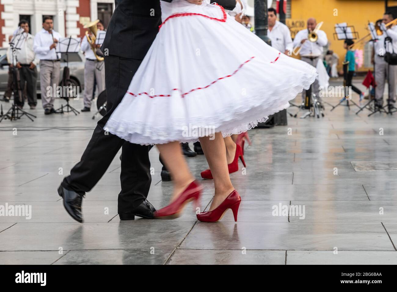 Male and Female dancers in colourful costumes performing traditional ...