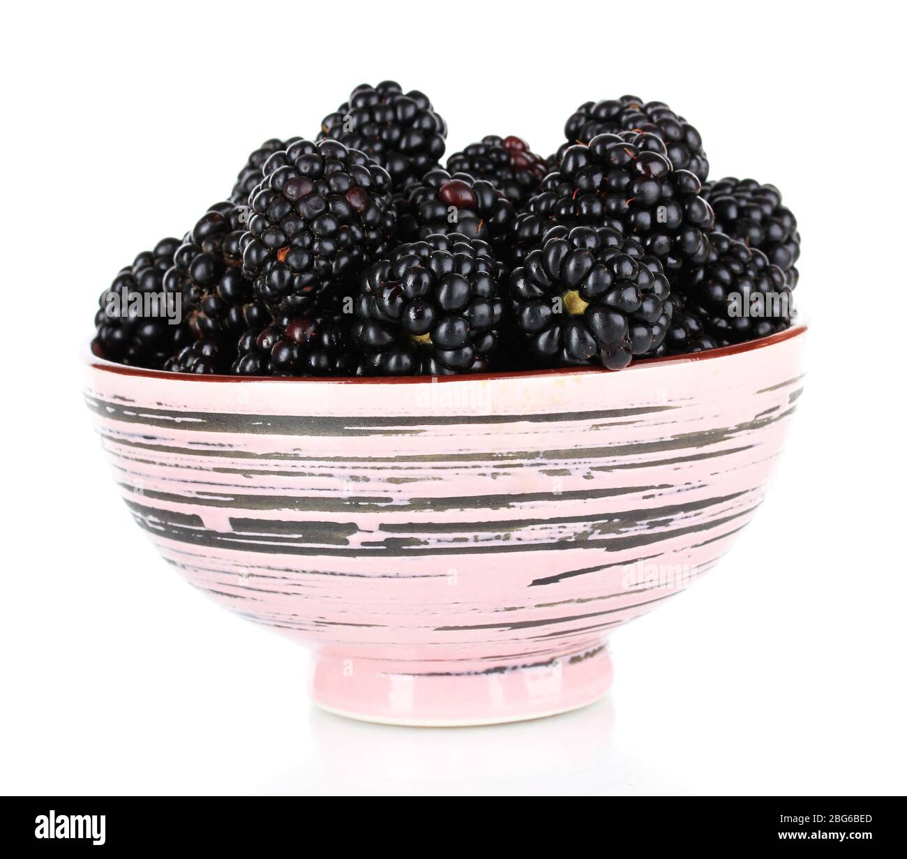 Sweet blackberries in bowl isolate on white Stock Photo - Alamy