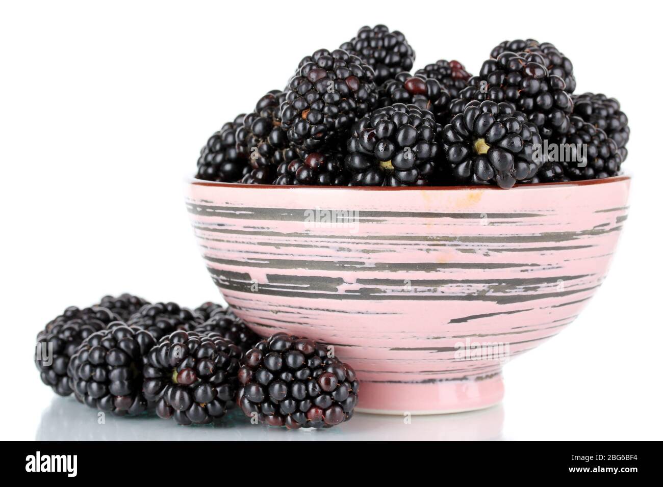 Sweet blackberries in bowl isolate on white Stock Photo - Alamy