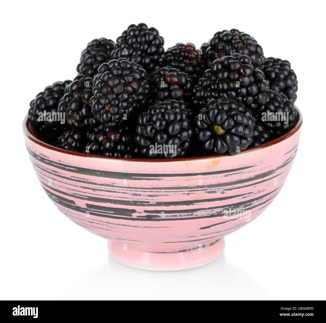 Sweet blackberries in bowl isolate on white Stock Photo - Alamy
