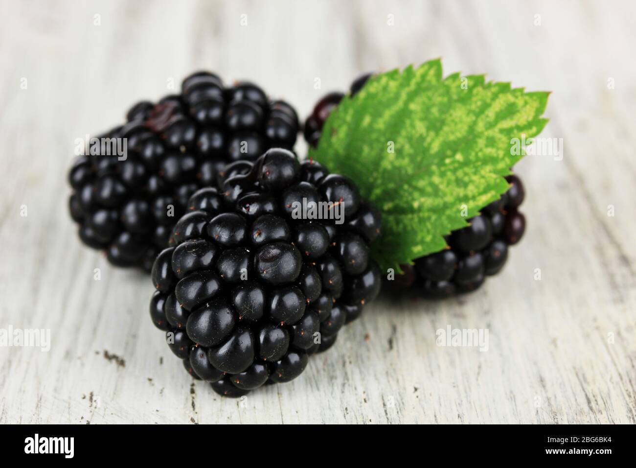Sweet blackberries on table close-up Stock Photo - Alamy