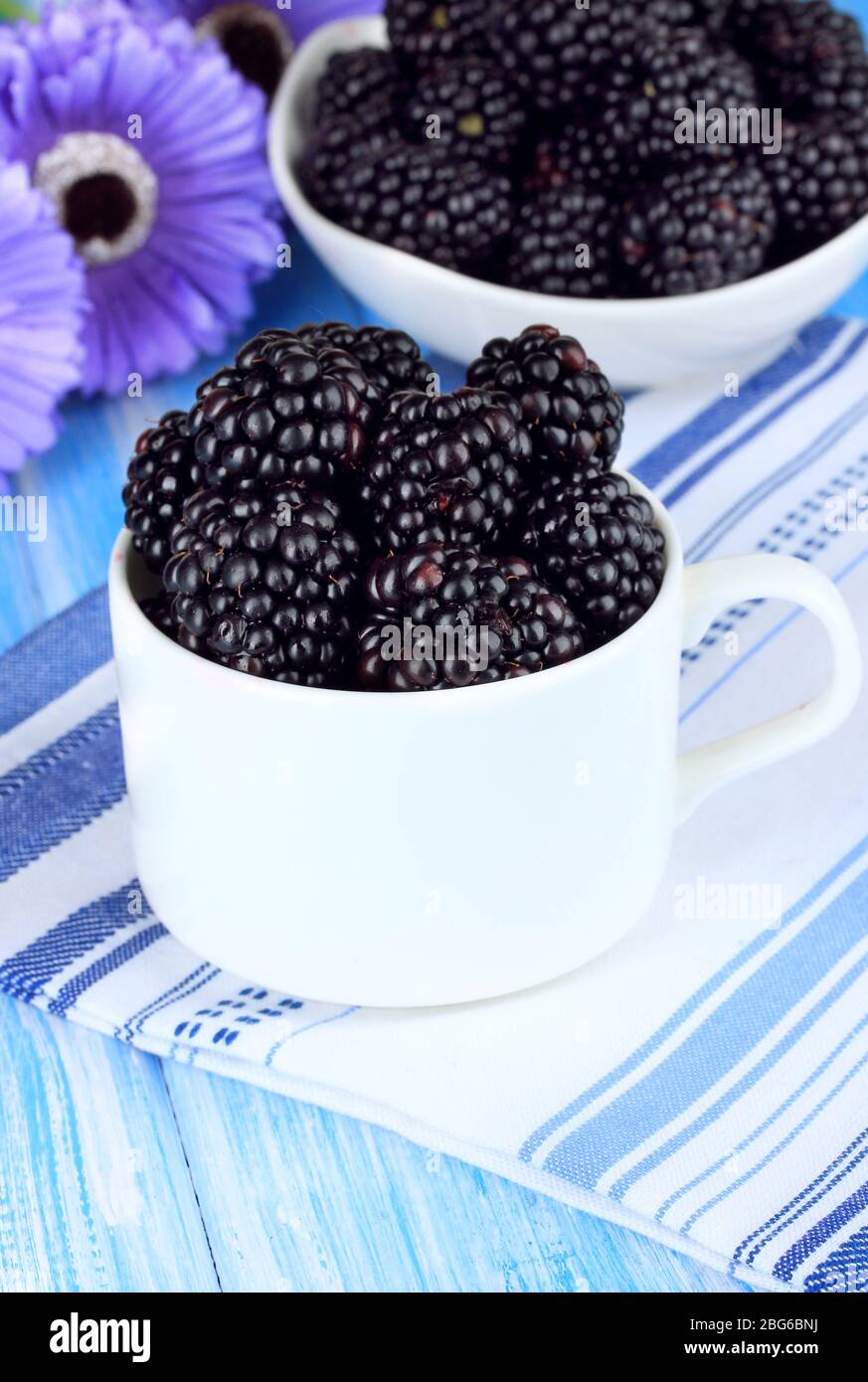 Sweet blackberries in cup on table close-up Stock Photo - Alamy