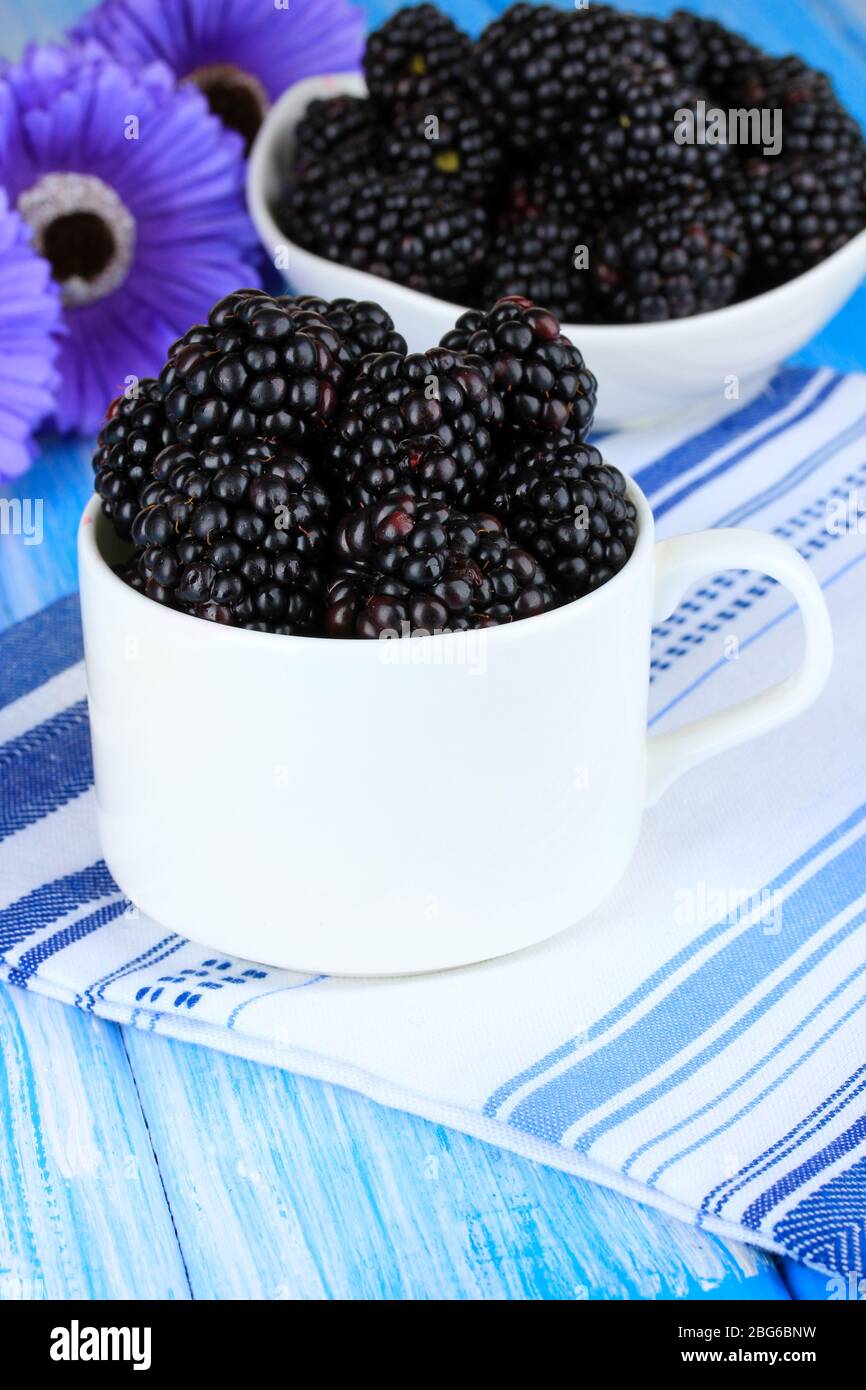 Sweet blackberries in cup on table close-up Stock Photo - Alamy