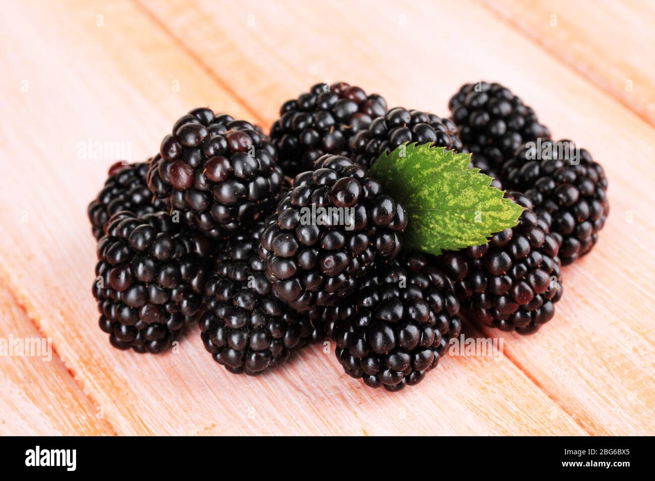 Sweet blackberries on table close-up Stock Photo - Alamy