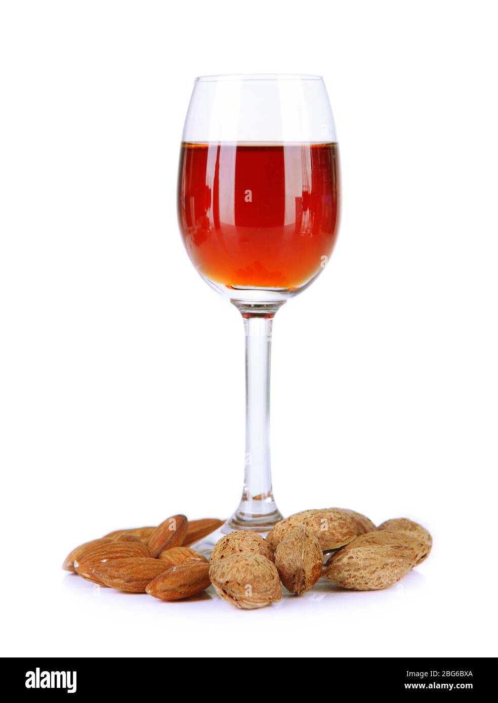 Glass of amaretto liquor and roasted almonds, isolated on white Stock ...