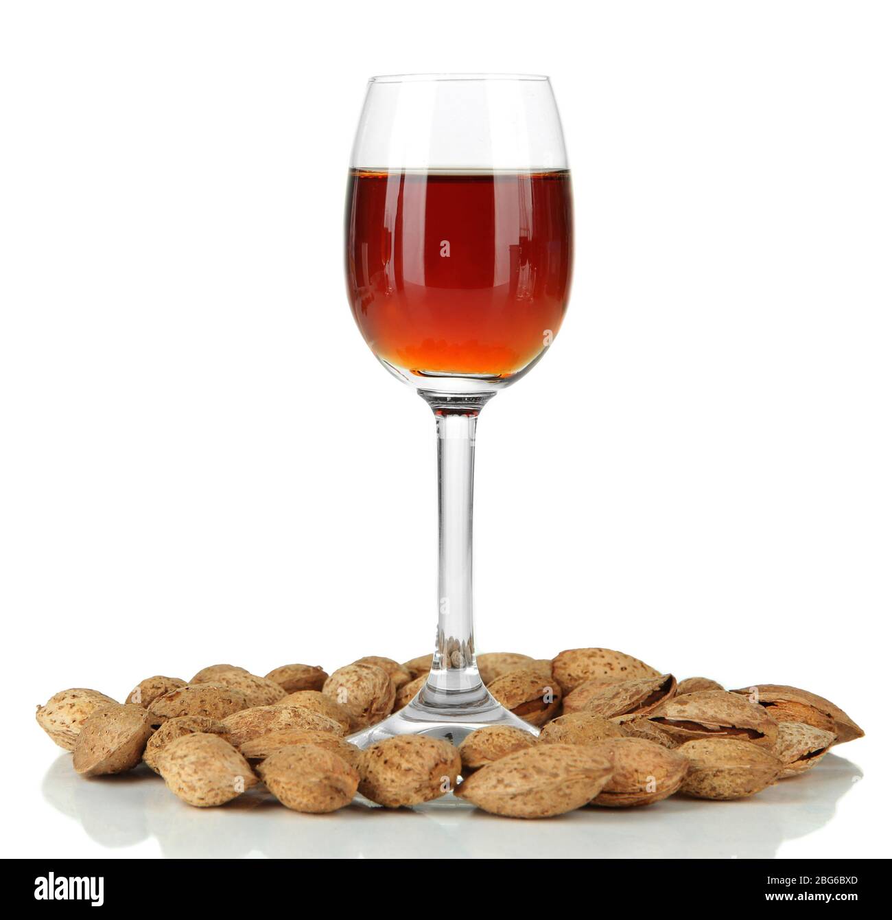 Glass of amaretto liquor and roasted almonds, isolated on white Stock ...