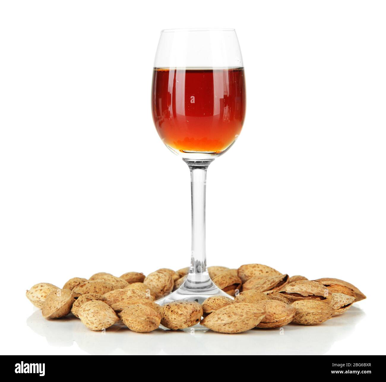 Glass of amaretto liquor and roasted almonds, isolated on white Stock ...