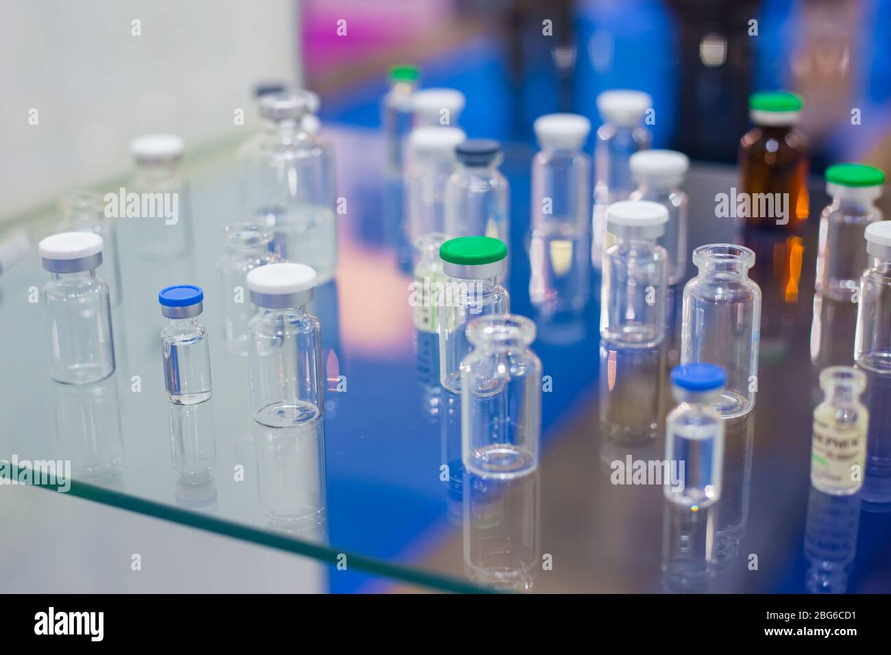 Medical empty glass bottles in showcase at pharmaceutical exhibition ...