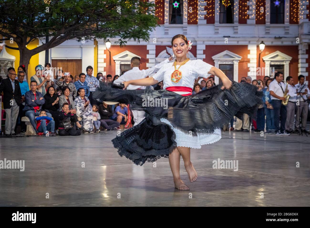 Male and Female dancers in traditional costume performing La Marinera ...