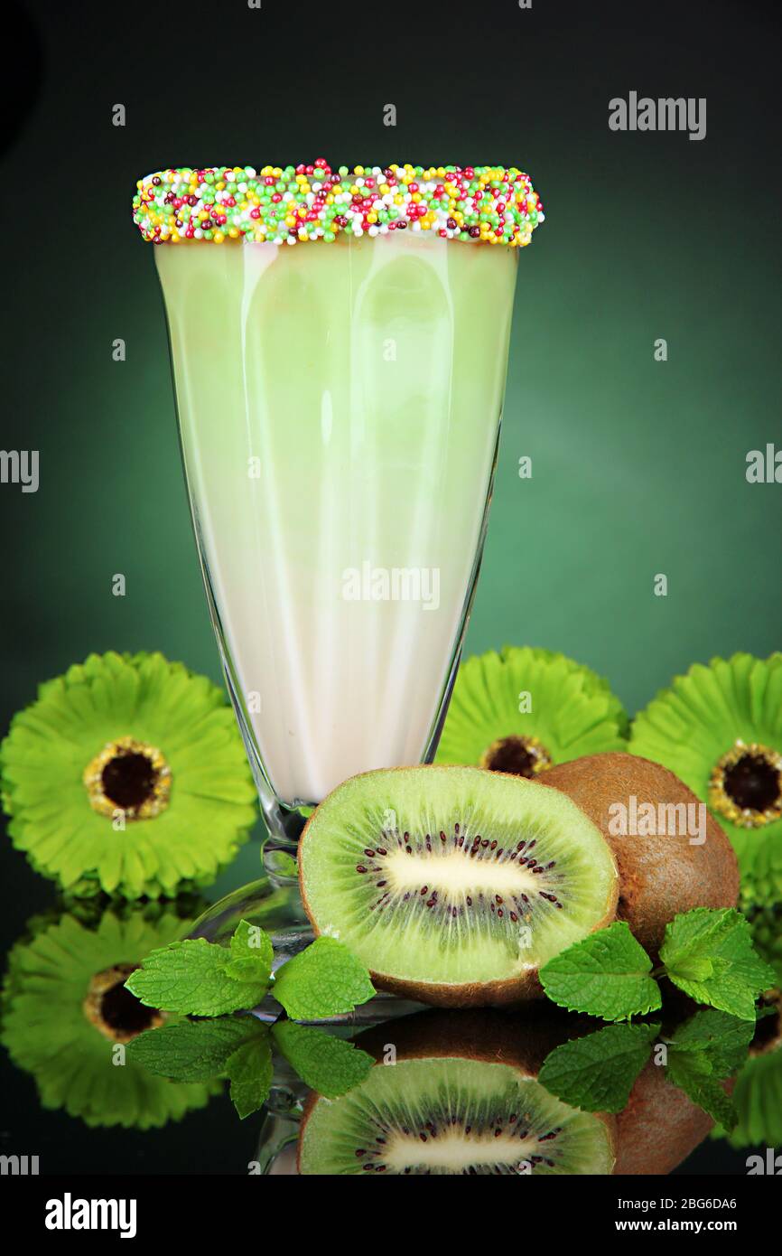 Delicious milk shake on dark green background Stock Photo - Alamy