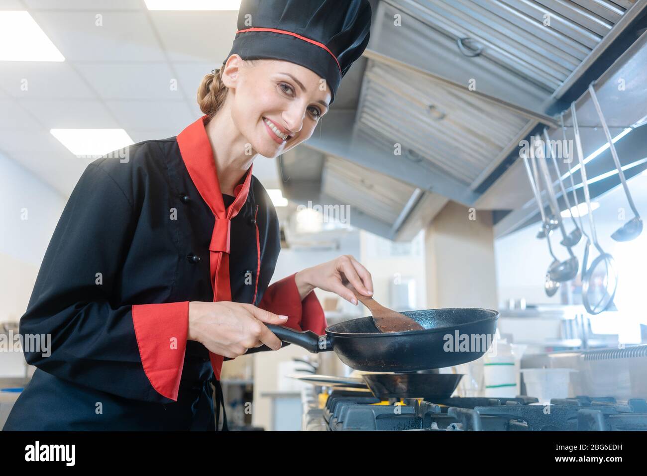 Chef stirring a meal Stock Photo - Alamy